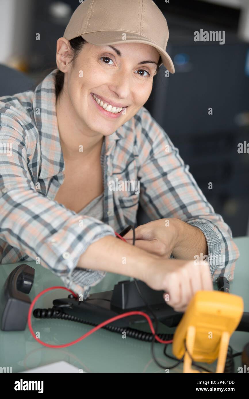 female labourer smiling at the camera Stock Photo - Alamy