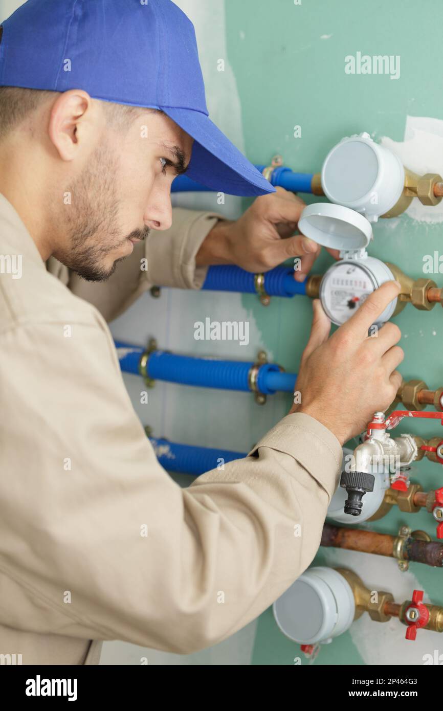 Workman installing domestic water hi-res stock photography and images ...