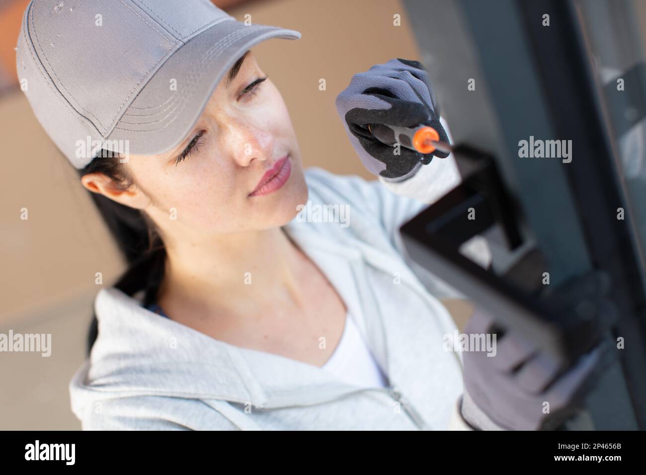 window setter inspecting the window Stock Photo - Alamy