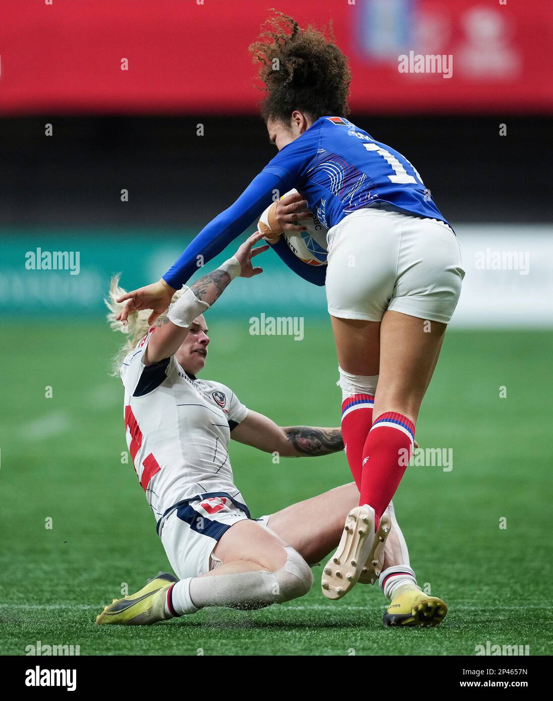 United States' Samantha Sullivan, left, tackles France's Caroline ...