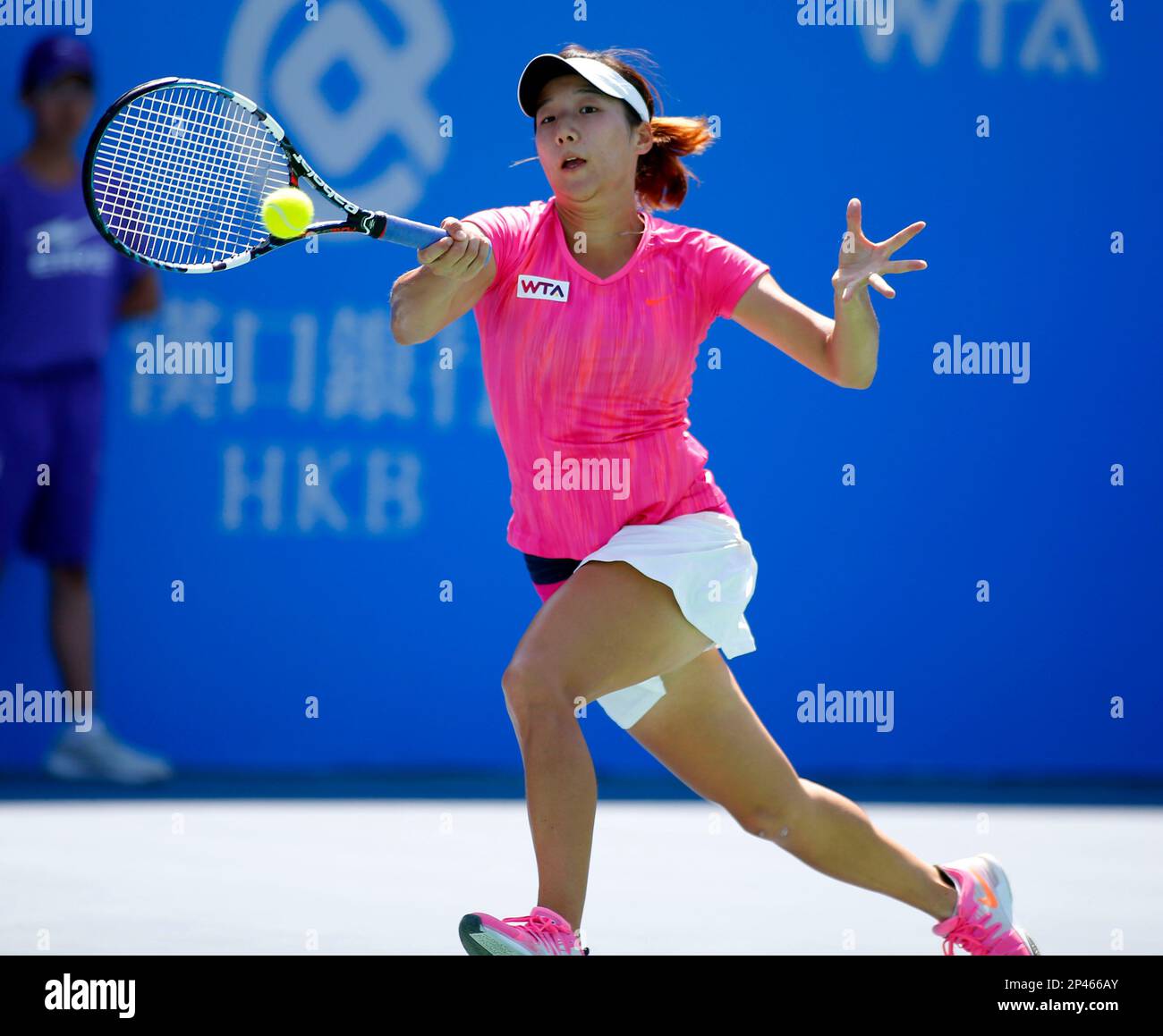 China's Zhang Kailin returns a shot to Spain's Carla Suarez Navarro ...