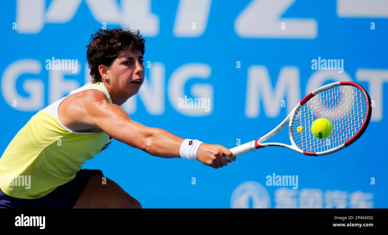 Spain's Carla Suarez Navarro returns a shot to China's Zhang Kailin ...
