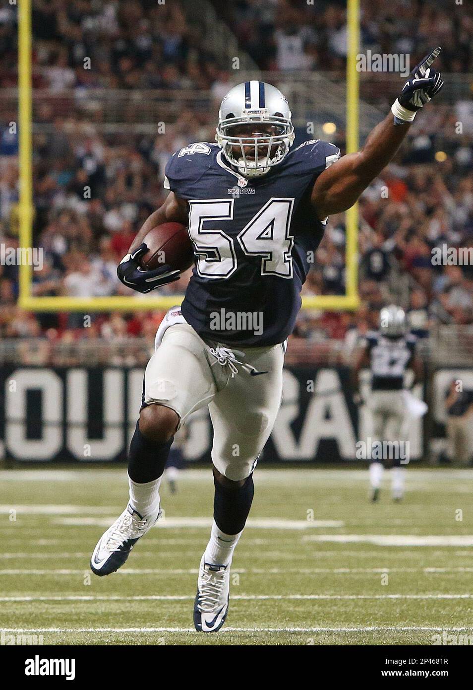 Dallas Cowboys linebacker Bruce Carter celebrates as he returns an ...