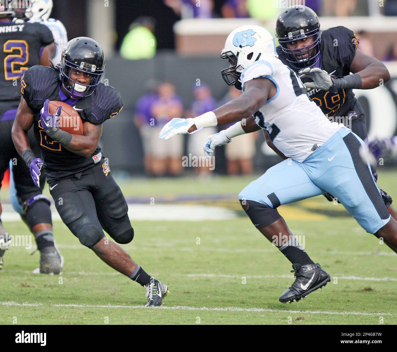 East Carolina's Breon Allen (25) runs through North Carolina defense ...