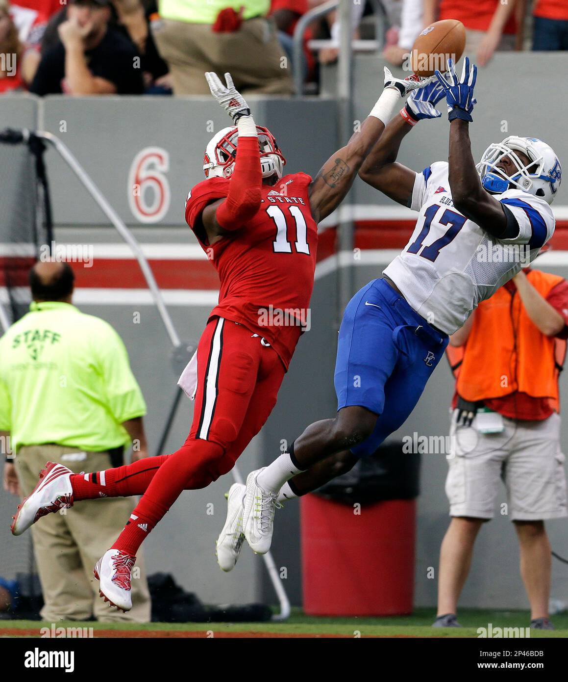 North Carolina State's Juston Burris (11) breaks up a pass intended for ...