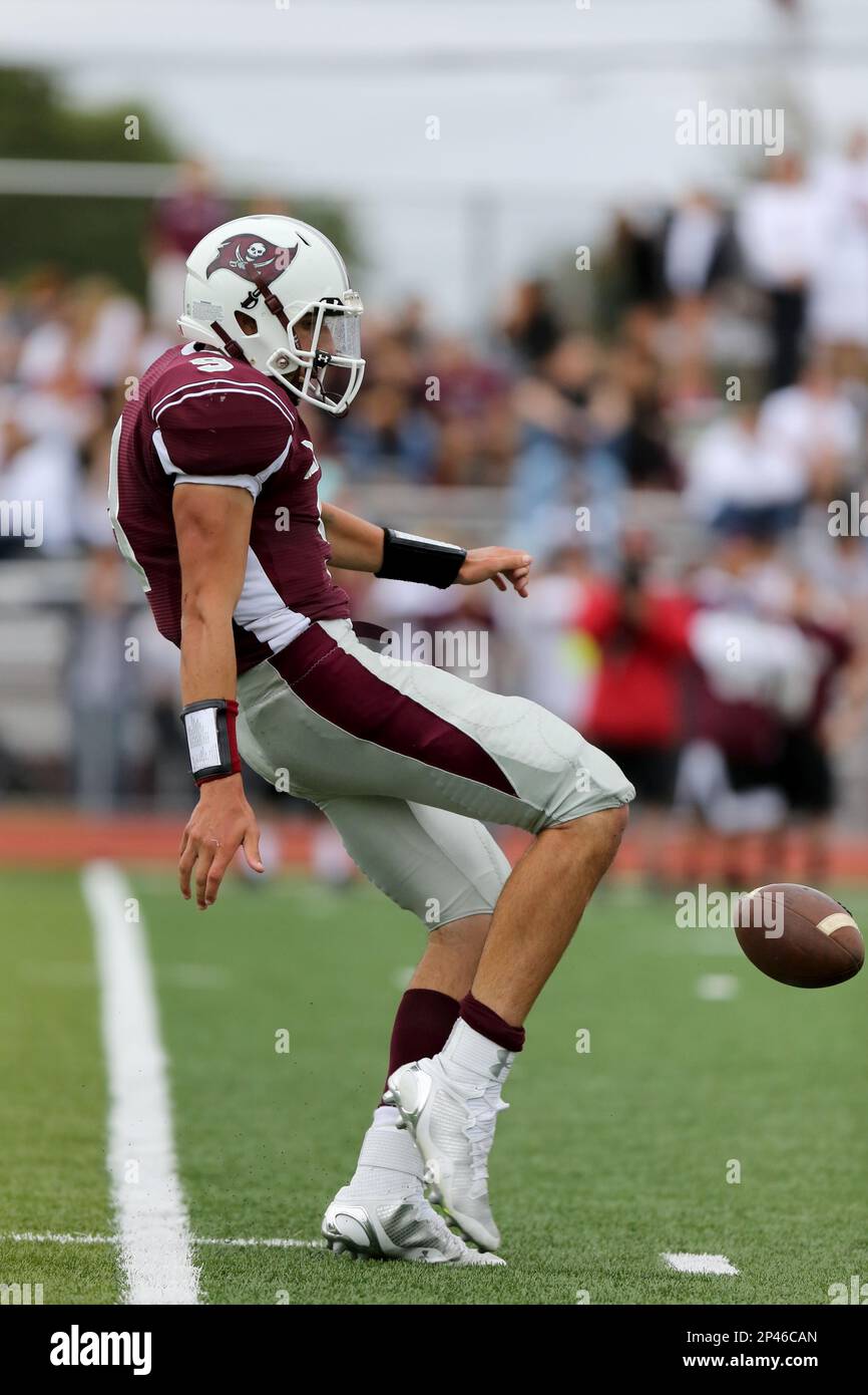 Mepham Pirates QB Tyler Davis #9 in action, punting against the Carey ...