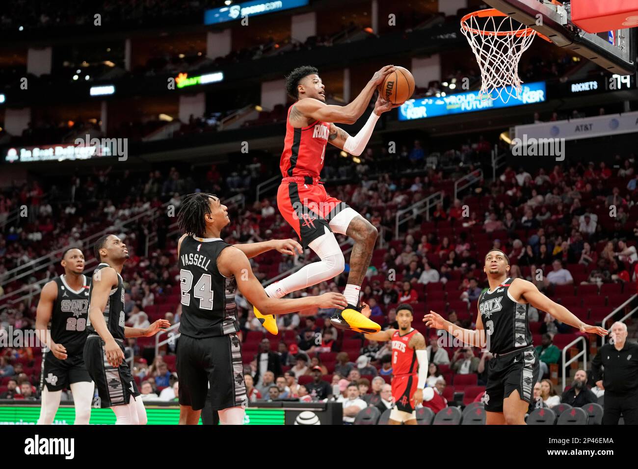 Houston Rockets guard Jalen Green, center, drives to the basket past ...