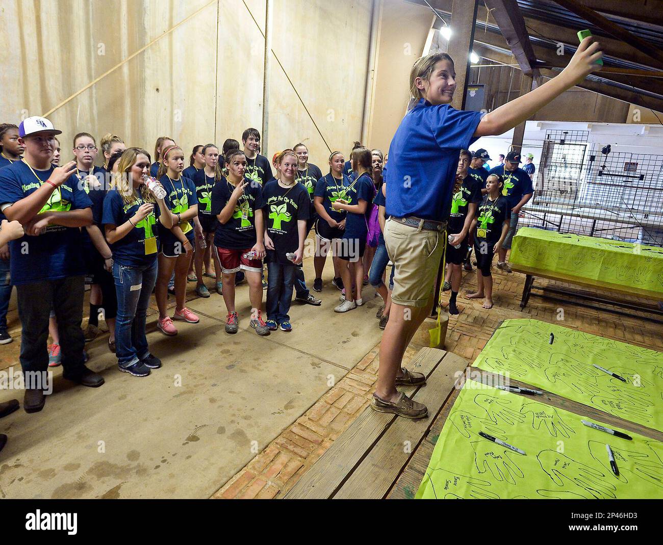 Camp leader Erin Scamans,16, right, of Colmesneil, Texas, takes a ...