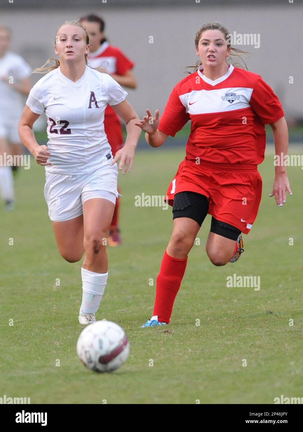 Ashland's Hannah Reese (22) and Boyd County's Adara Lee chase a ball ...