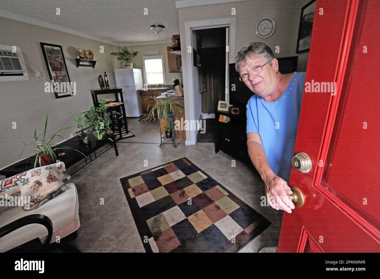 Nancy Eccles , owner of the Walls Villas along with her husband Jess, shows one of the renovated ...