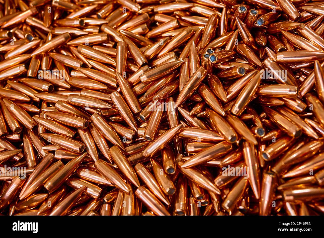 Large caliber copper shells pile for riffle as background Stock Photo ...