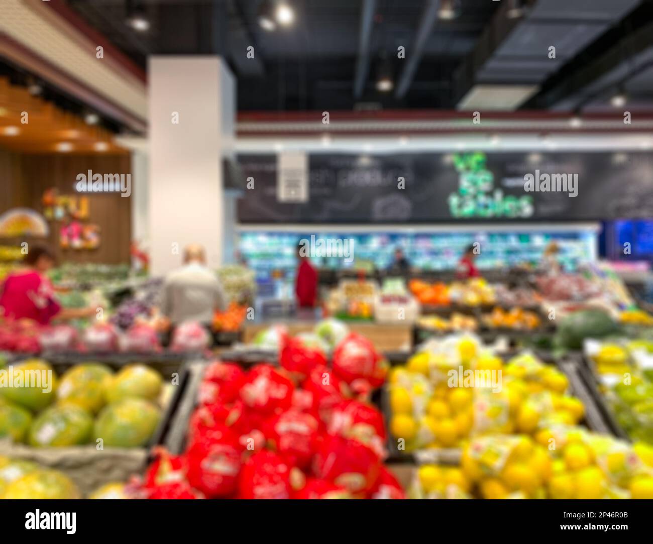 Inside a supermarket with shoppers. Blur or defocused for background ...