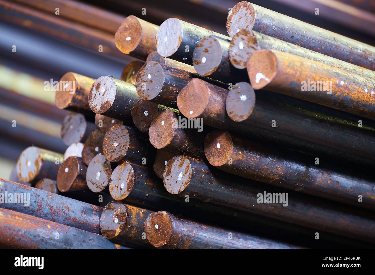 Round steel section rolling profile stacked at plant Stock Photo - Alamy
