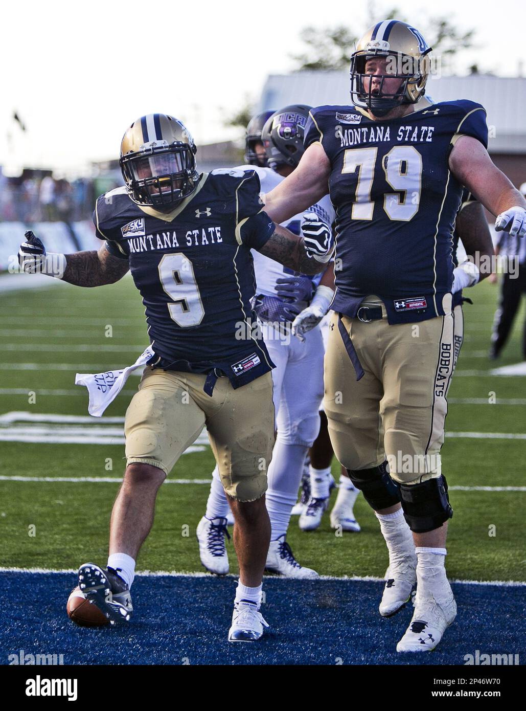 Montana State running back Anthony Knight, left, celebrates with ...