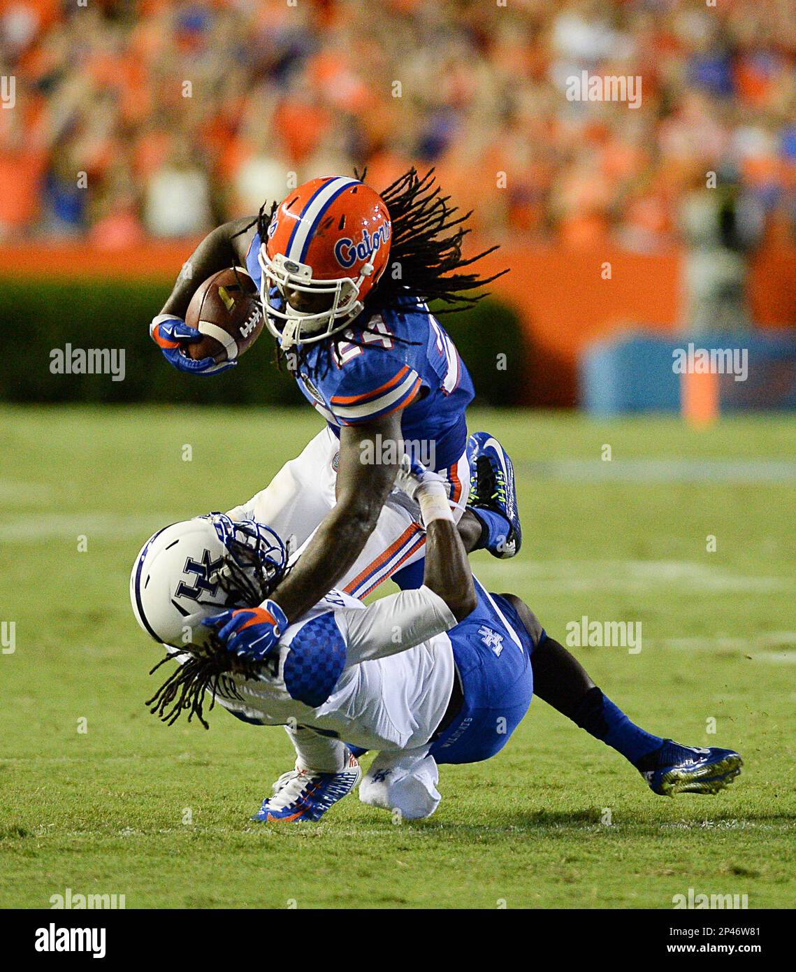 Kentucky cornerback Fred Tiller (3) brings down Florida's Matt Jones ...