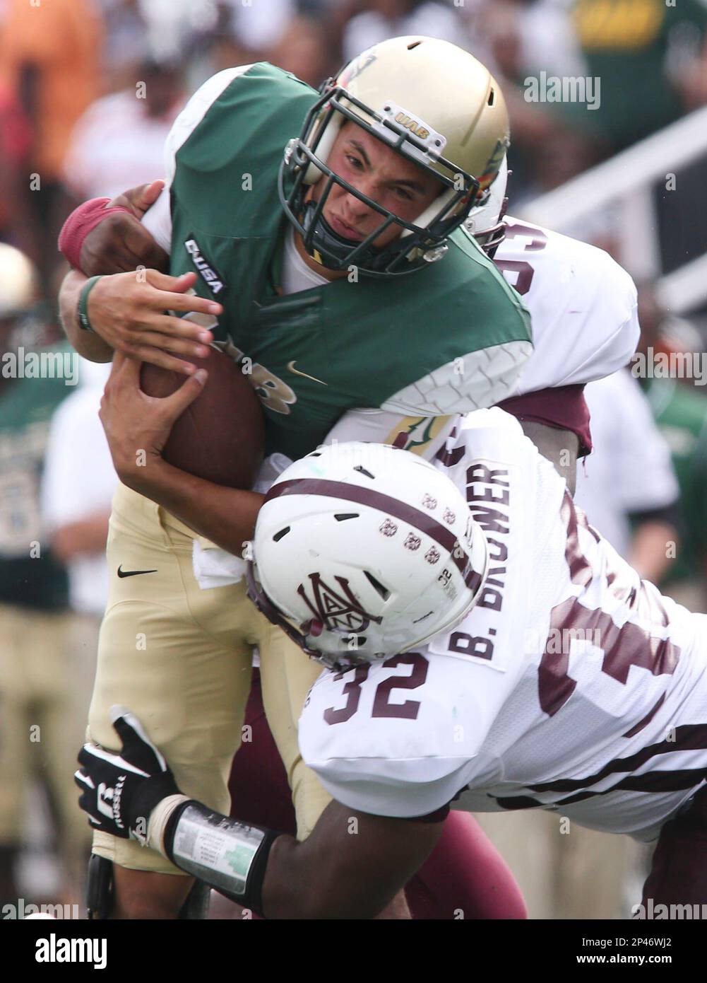 Alabama A&M linebacker Byran Brower (32) sacks UAB quarterback Cody ...
