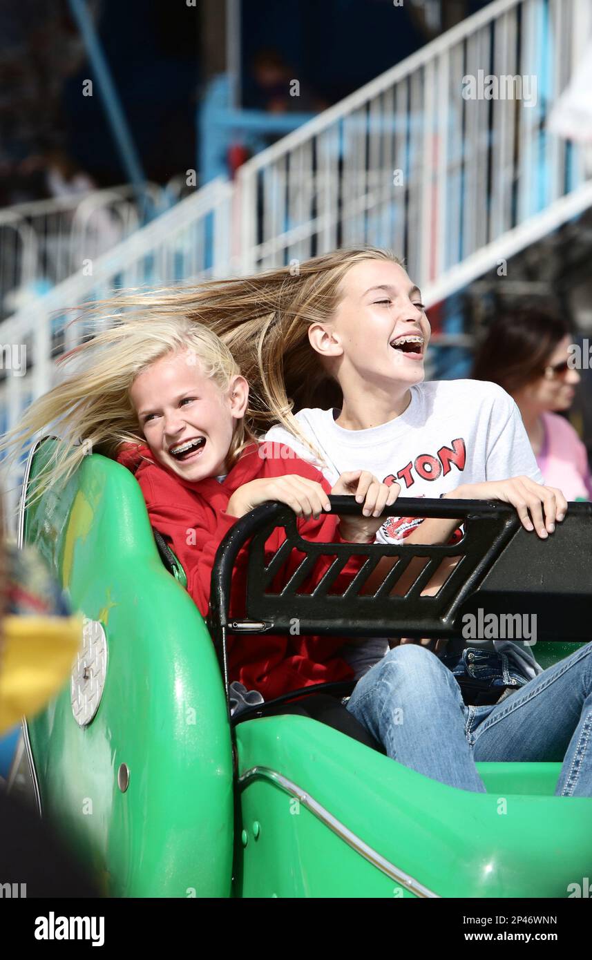 Hannah Ferguson, 12, left, and Talby Duerksen, 12, ride the Sizzler at ...