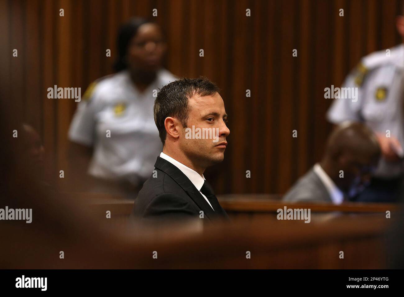 Oscar Pistorius looks ahead as he sits in court in Pretoria, South ...