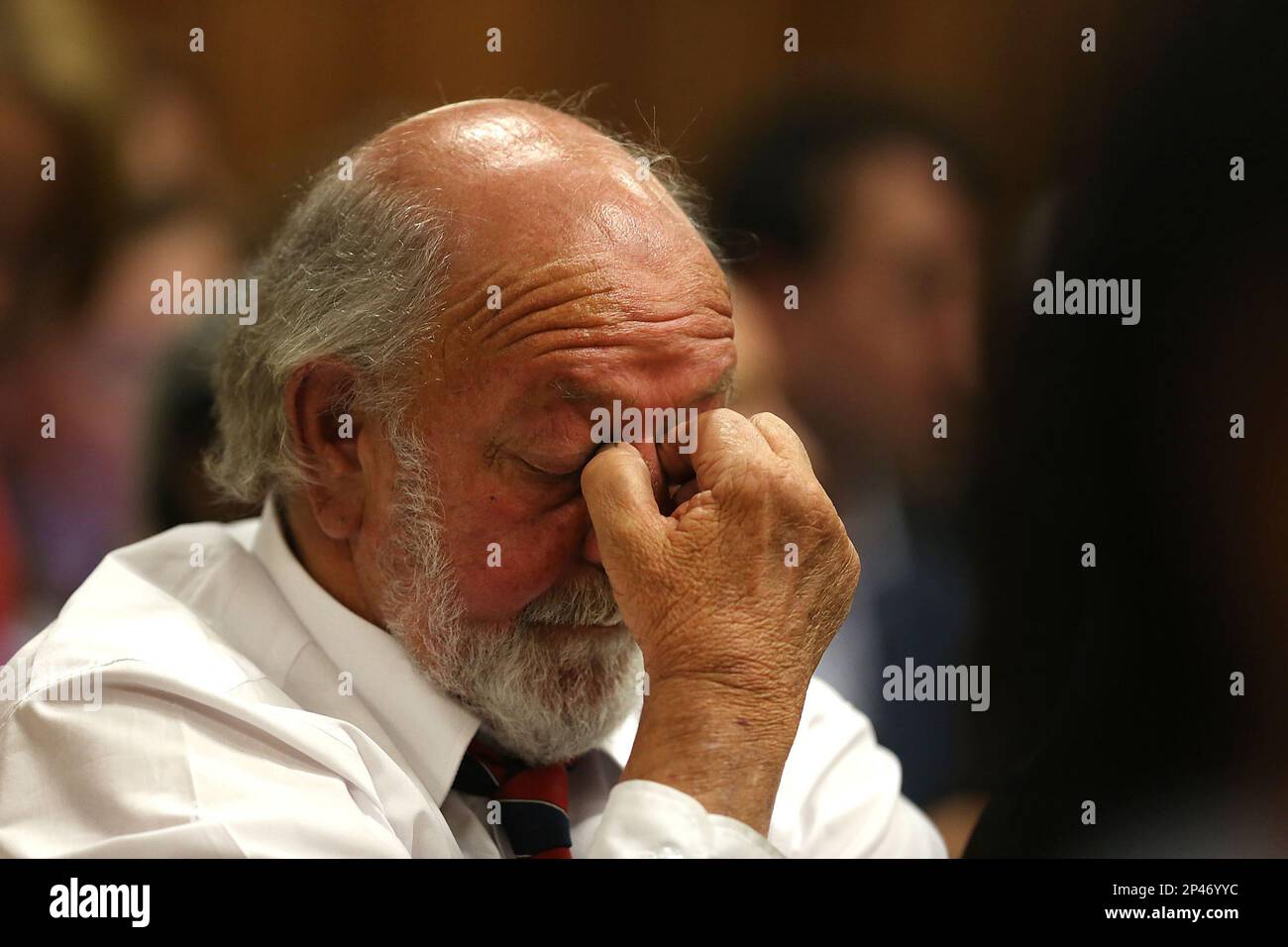 Father of the late Reeva Steenkamp, Barry Steenkamp, rubs his eyes in ...