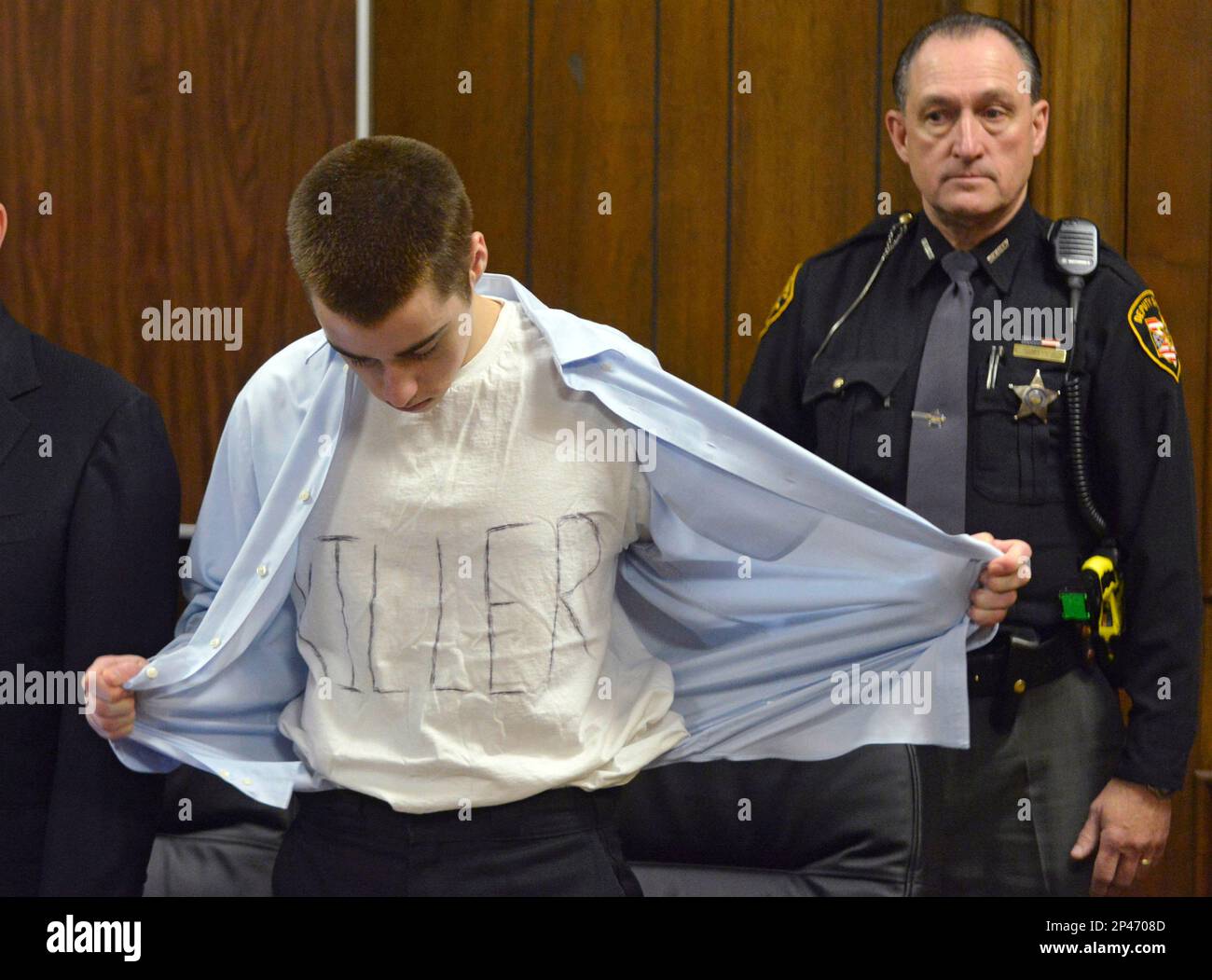 FILE - In this Tuesday, March 19, 2013, file photo, T.J. Lane unbuttons ...