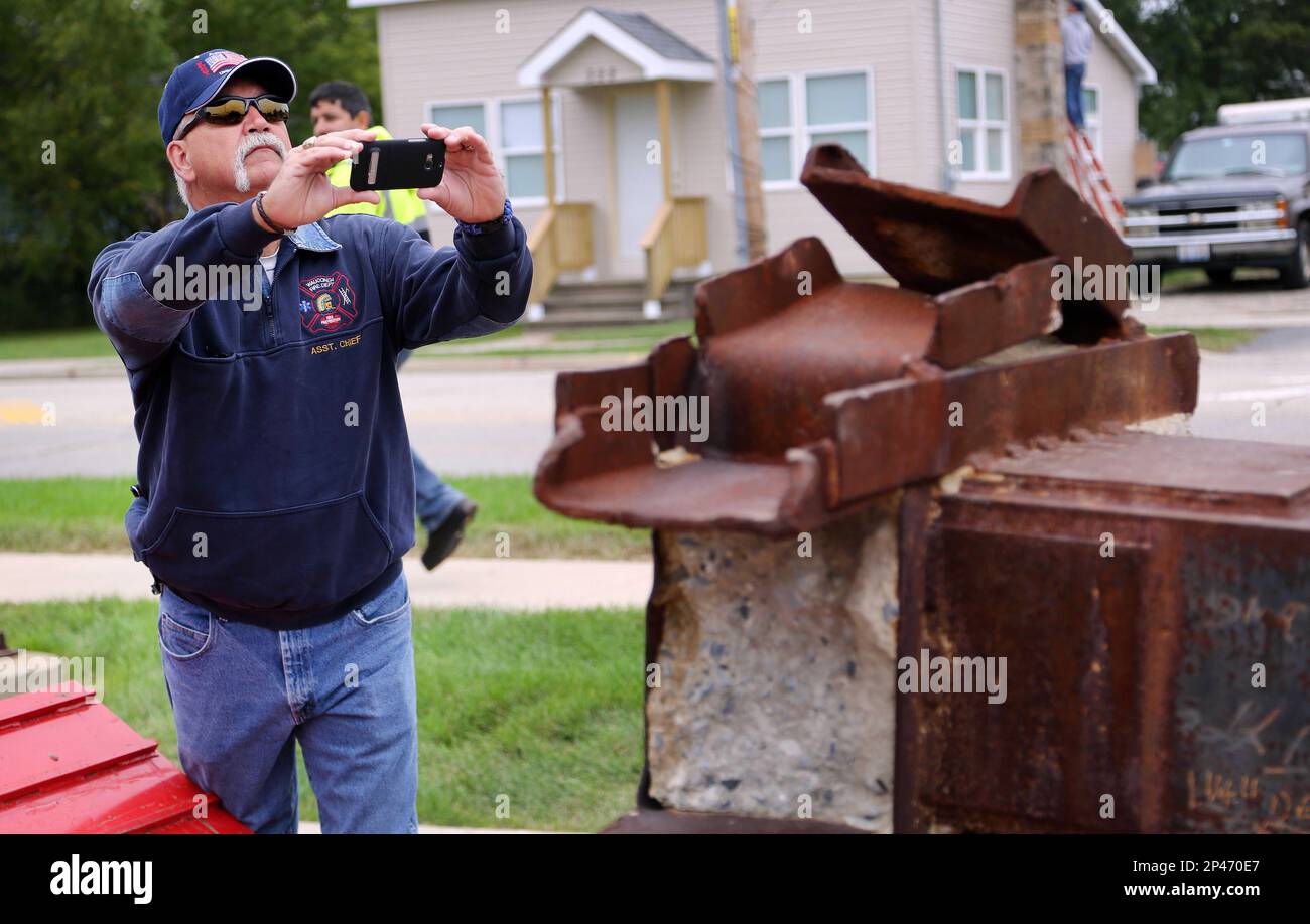 Retired Wauconda, Ill. Deputy Fire Chief Bill Glade takes a picture of ...