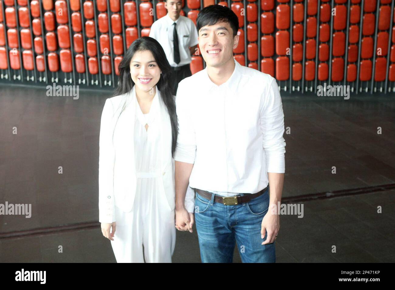 Chinese star hurdler Liu Xiang, right, and his actress wife Ge Tian ...