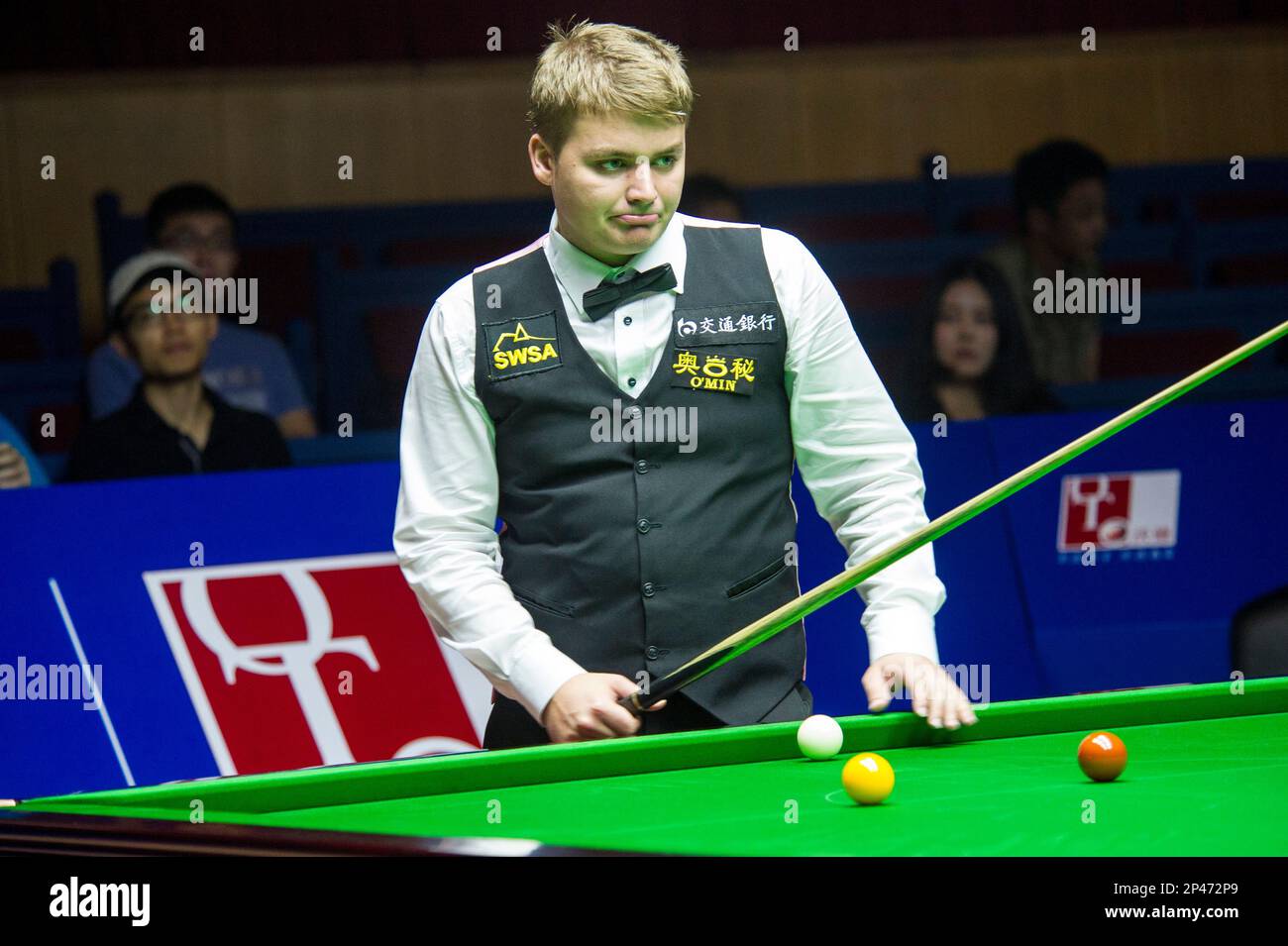 Michael White of Wales considers a shot against Neil Robertson of ...