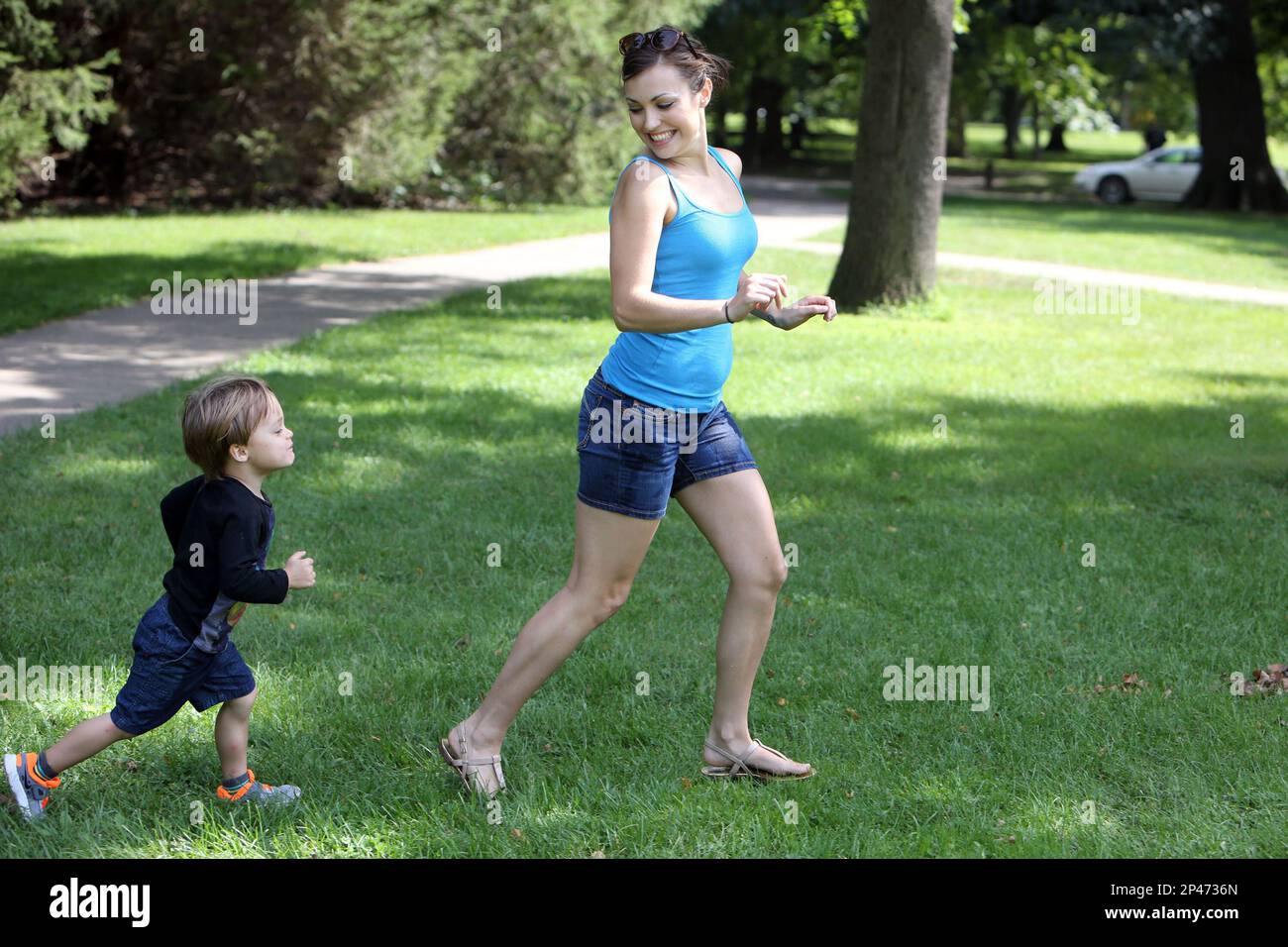 In this Sept. 8, 2014 photo, Emily Hartsock playfully runs from her son ...