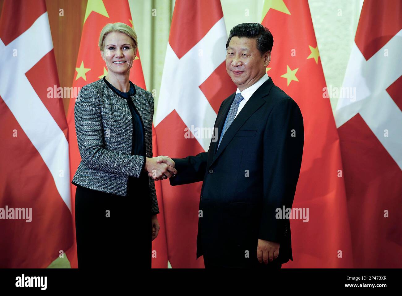 Danish Prime Minister Helle Thorning-Schmidt, left, shakes hands with ...