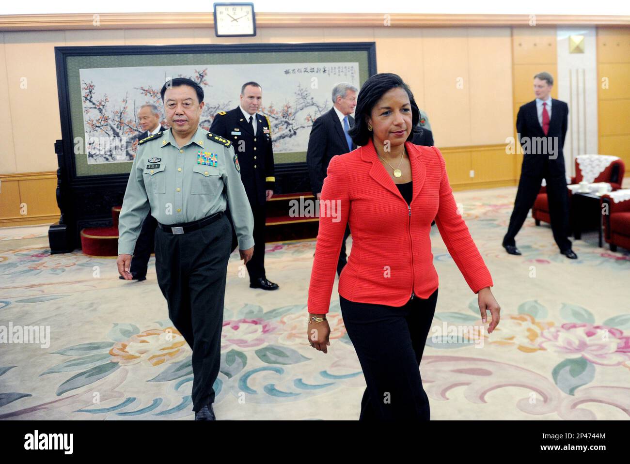 U.S. National Security Advisor Susan Rice, center, walks with Fang ...