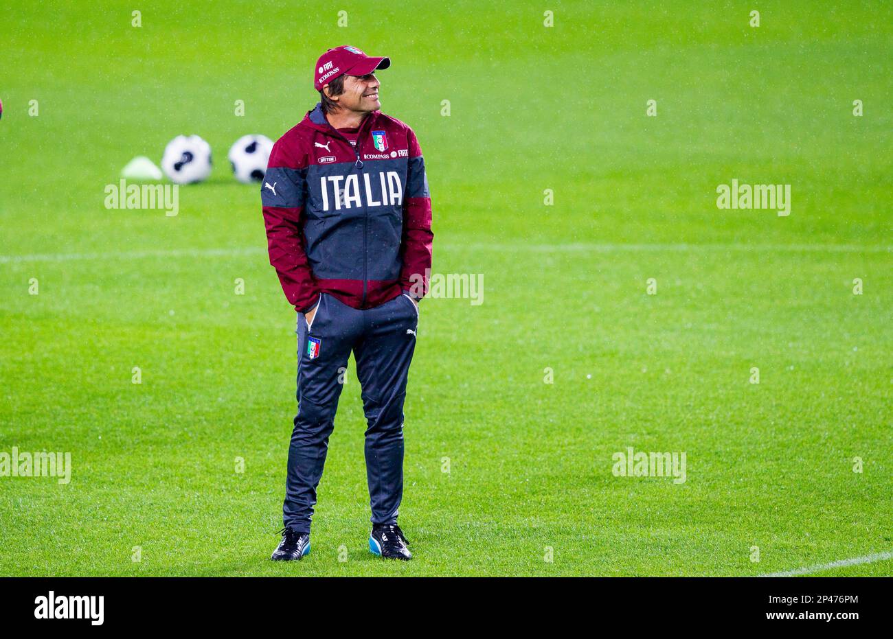 The Italian national soccer team coach, Antonio Conte, observes his ...