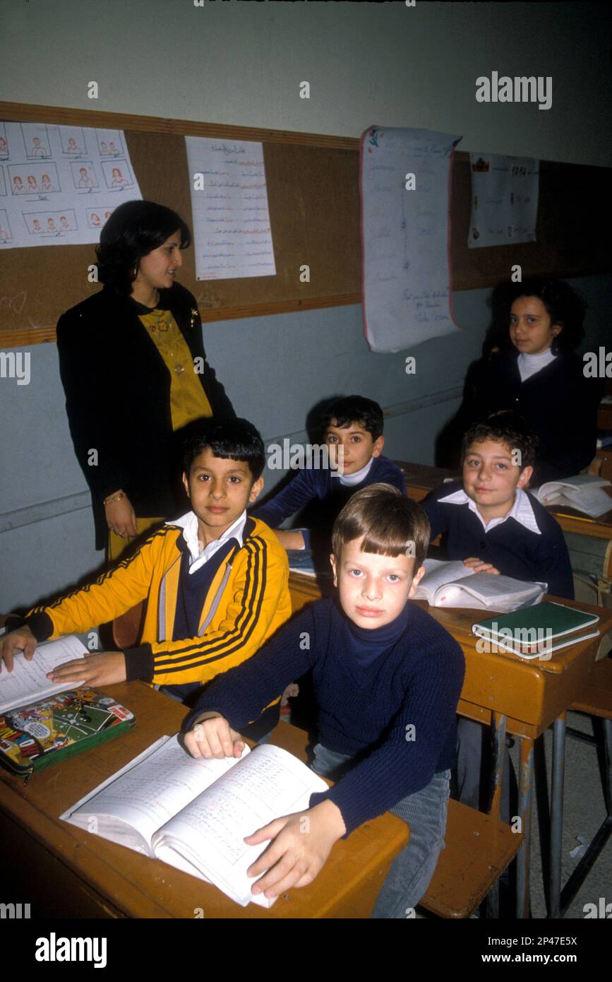 Young school students with female teacher in Amman, Jordan 1983 Stock ...
