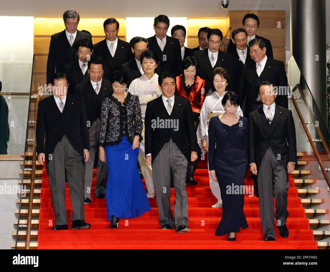 Japanese Prime Minister Shinzo Abe (front, C), attends an inaugural ...