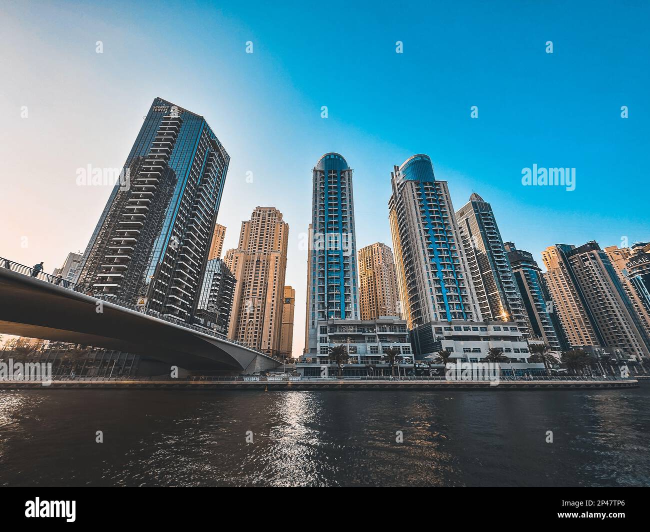 Dubai Marina, harbour, cruise boat and canal promenade view at sunset ...