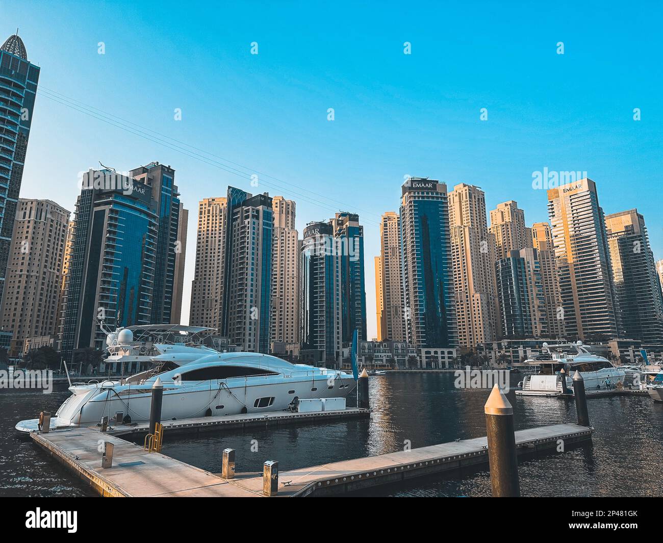 Dubai Marina, harbour, cruise boat and canal promenade view at sunset ...