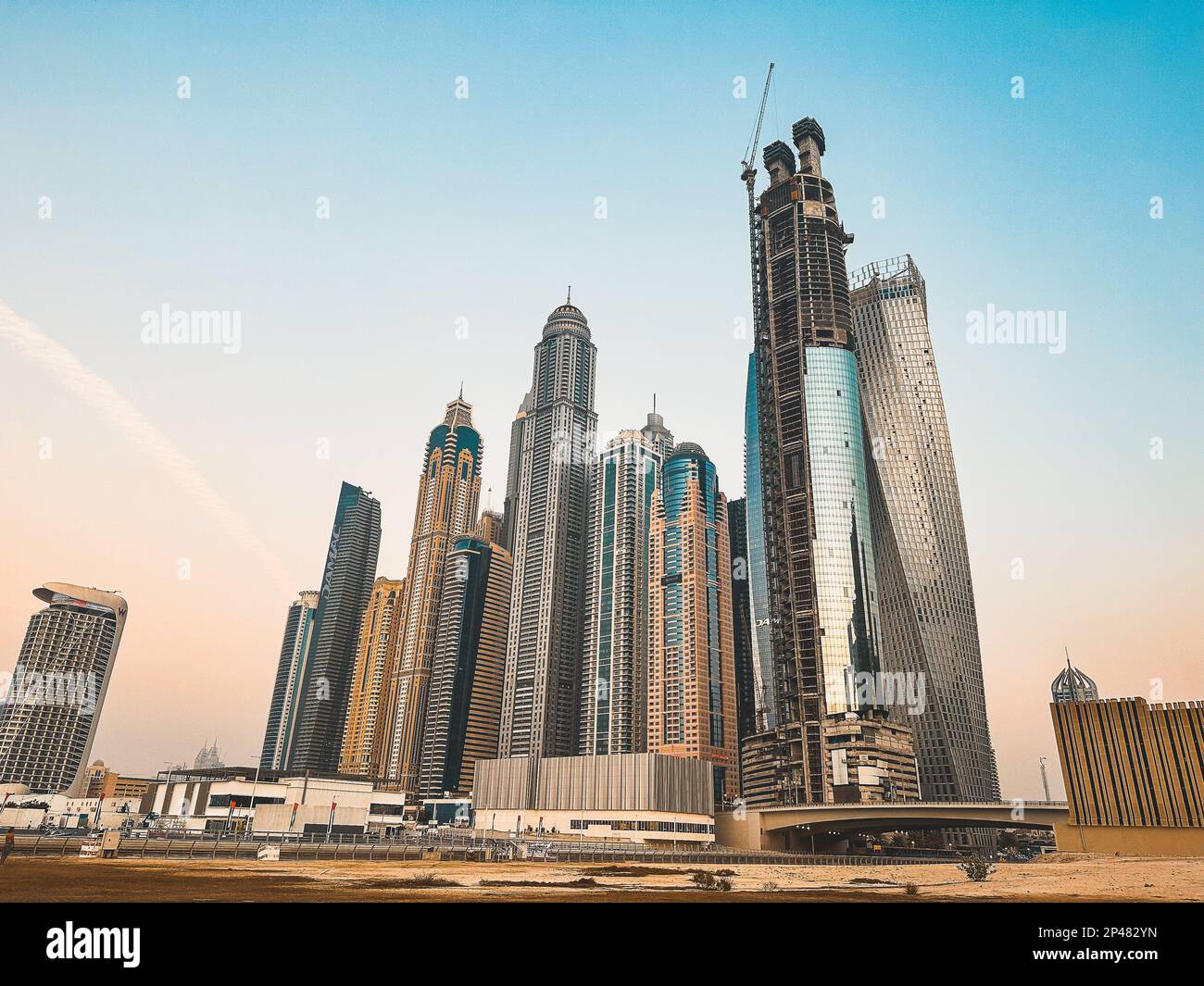 Dubai Marina, harbour, cruise boat and canal promenade view at sunset ...