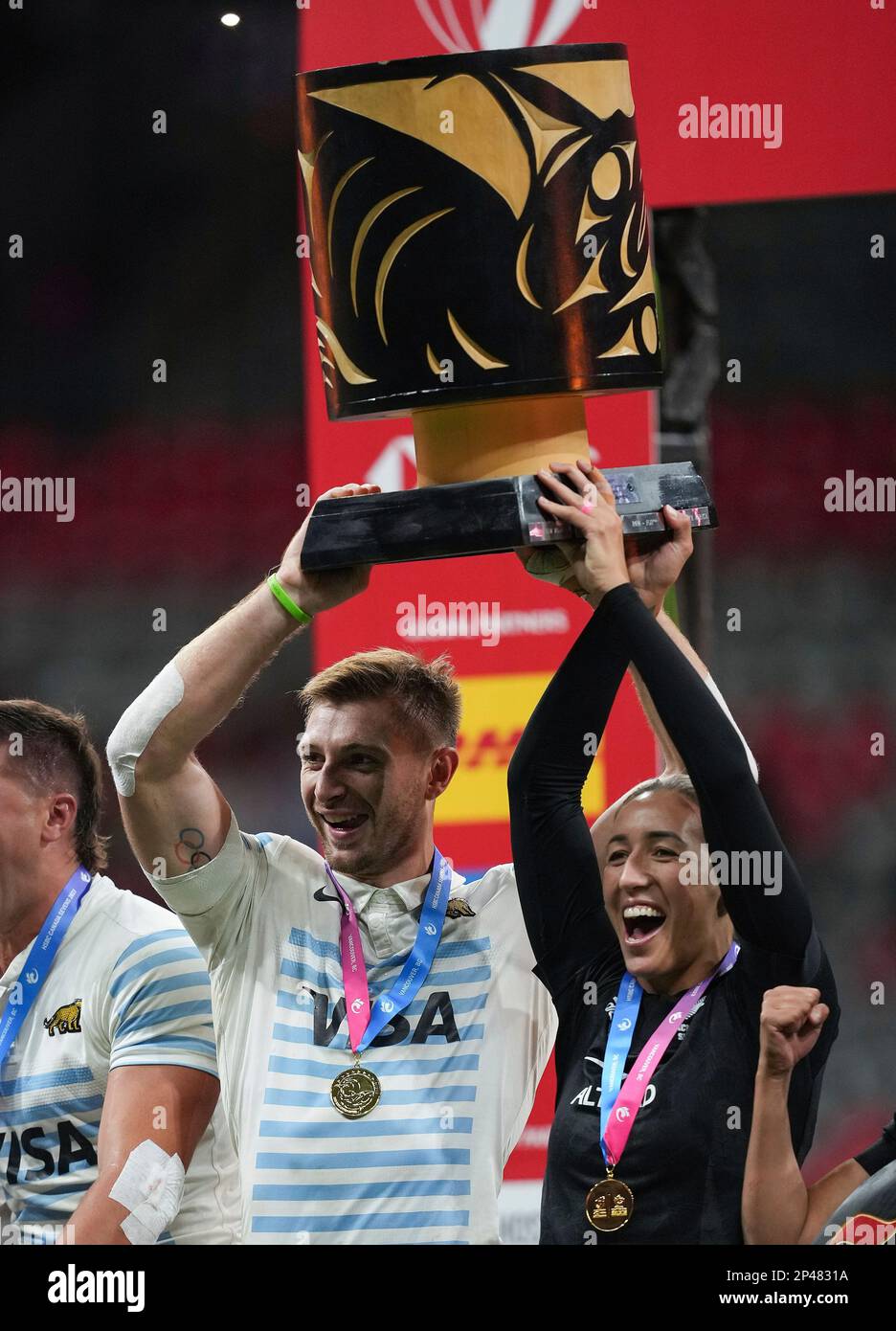 Argentina Matias Osadczuk, left, and New Zealand's Sarah Hirini hoist ...