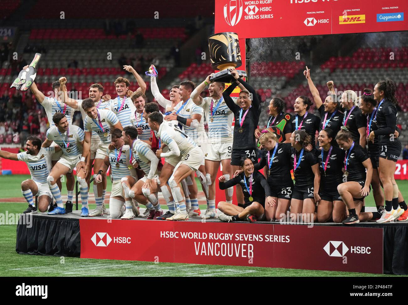 Argentina Matias Osadczuk and New Zealand's Sarah Hirini hoist the ...