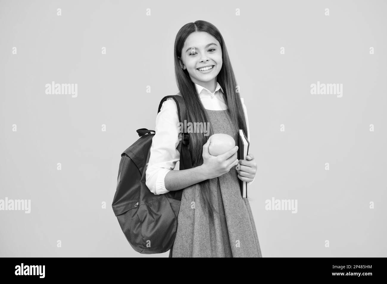 Child girl with an apple over isolated white background. Apples improve ...