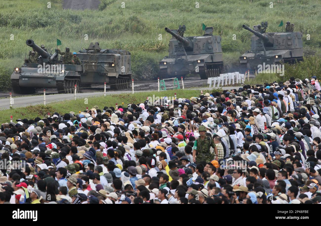 Members of Japan’s Ground Self Defence Force deploy a live-firing drill ...