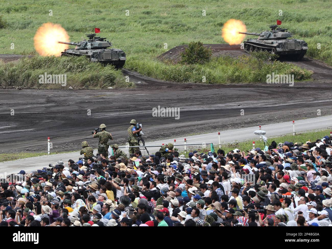 Members of Japan’s Ground Self Defence Force deploy a live-firing drill ...