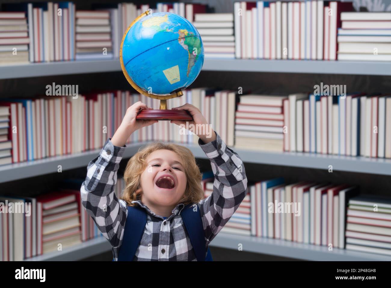Kid boy from elementary school with book. Little student, smart nerd ...