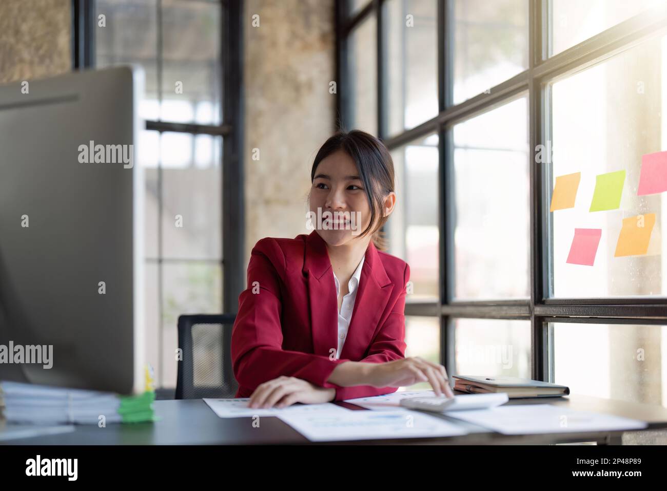 businesswoman working on desk office with using a calculator to ...