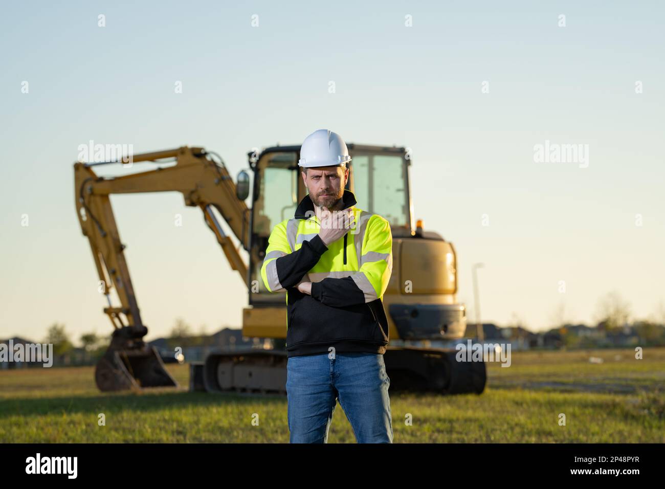 Worker with bulldozer on site construction. Man excavator worker ...