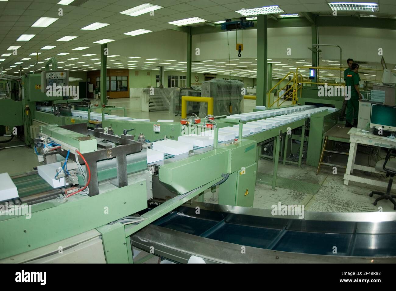 Paper on conveyor belt; Riau Pulp and Paper Mill (RAPP), near Pekanbaru ...