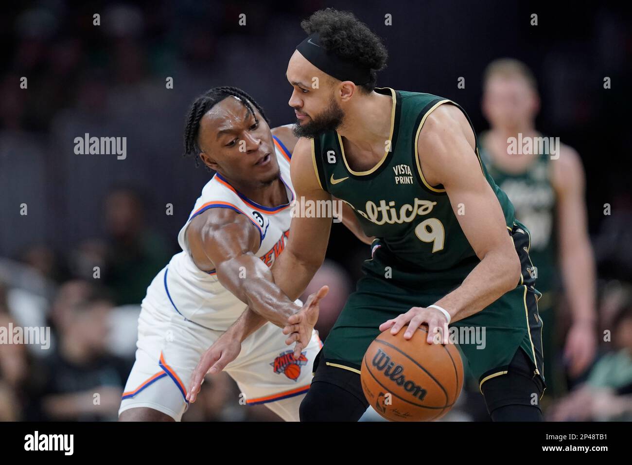 New York Knicks guard Immanuel Quickley, left, defends as Boston ...