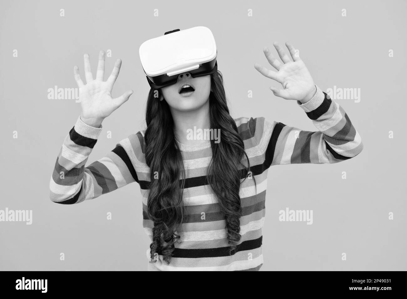 Amazed teenager using VR headset. Kid play vr video game. Digital ...