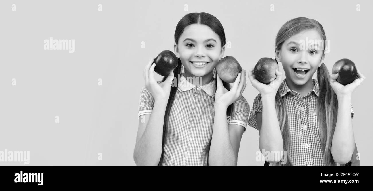 Happy children back to school holding apples for healthy eating ...