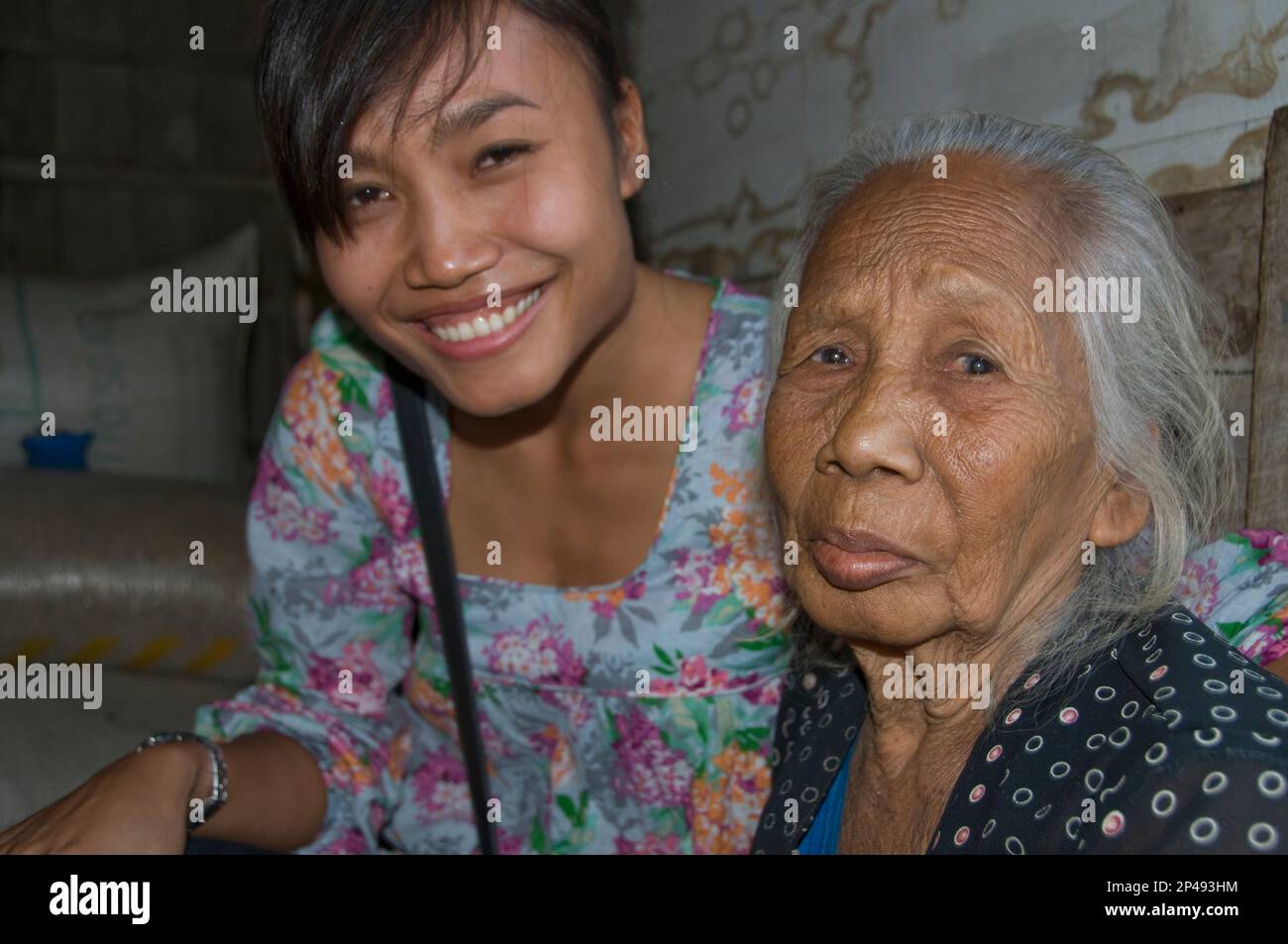 Girl and grandmother, Rural ("kampung") family in wooden house, Randu ...