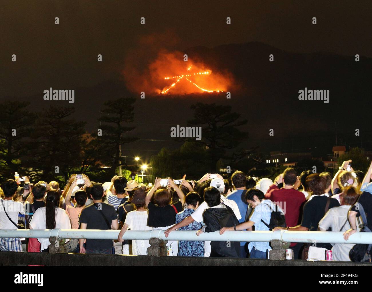 Tourists enjoy Chinese gigantic character "dai," meaning " big ...